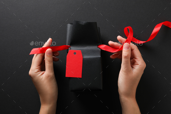 The concept of black friday, a gift in a black wrapper. Stock Photo by ...