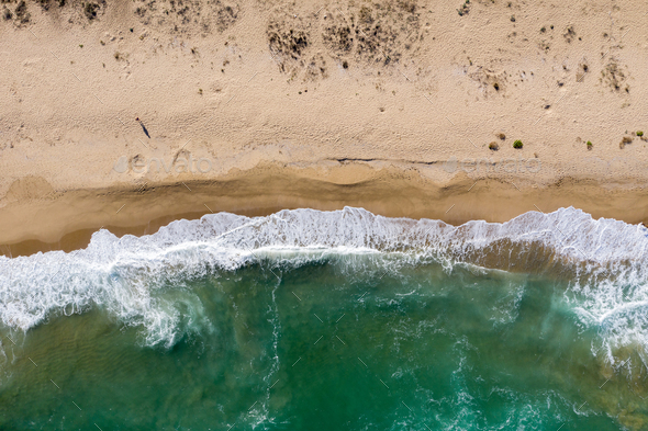 Aerial View of Ocean Waves Washing a Secluded Sandy Shoreline Stock ...