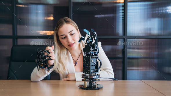 College Students research inventions robotics and robot arm ...