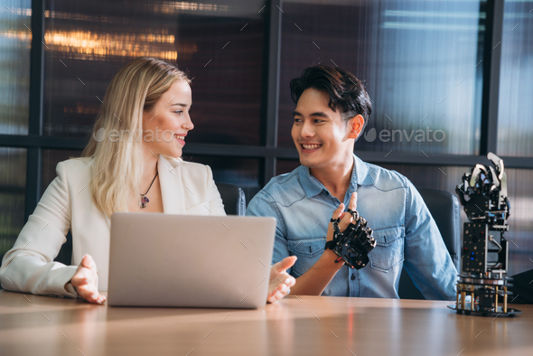 College Students research inventions robotics and robot arm ...