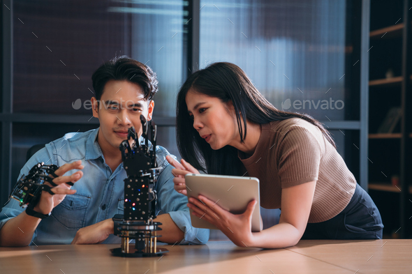 College Students research inventions robotics and robot arm ...