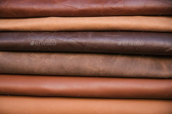 Array of leather fabric samples in different shades neatly placed on a ...