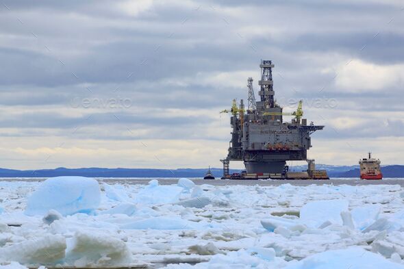 Offshore oil rig on the surface of icy water in the ocean. Stock Photo ...