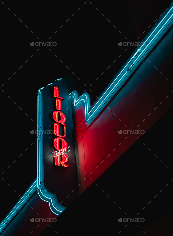 Red Liquor glowing red sign on a building with blue neon lights Stock ...