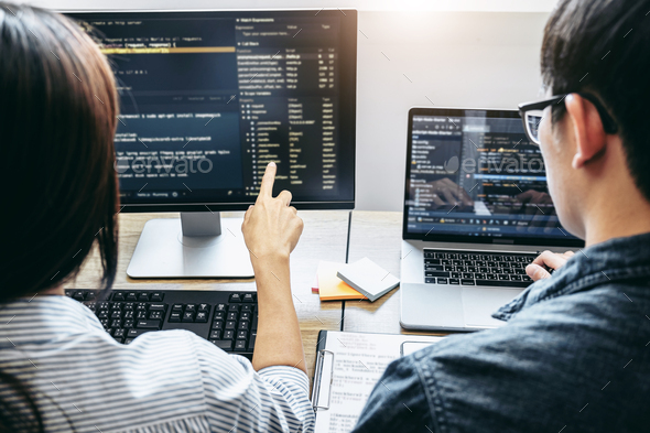 Writing codes and typing data code technology, Programmer team w Stock Photo by Freedomtumz