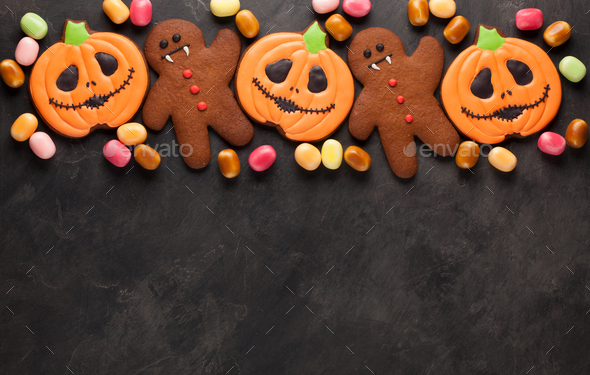 Halloween pumpkin, bat and gingerbread man-vampire cookies and colorful ...