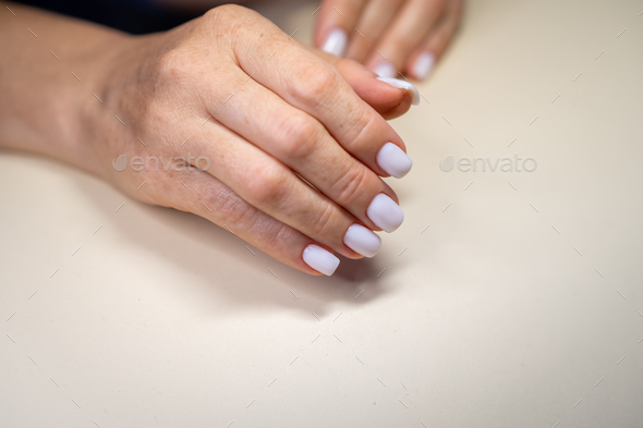 Female hands and tools for manicure, process of performing manicure ...