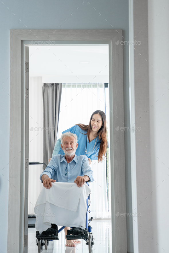 Medical staff taking and caregiver senior man in Home. Home care ...