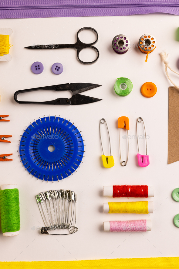 Image of sewing materials with scissors, buttons and threads on cream ...