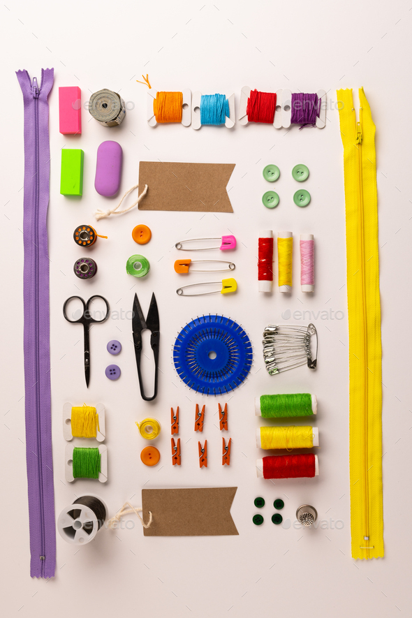 Image of sewing materials with scissors, buttons and threads on cream ...