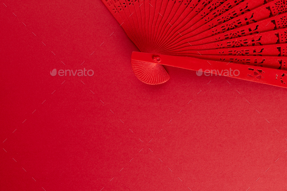 Composition of traditional chinese fan on red background Stock Photo by ...