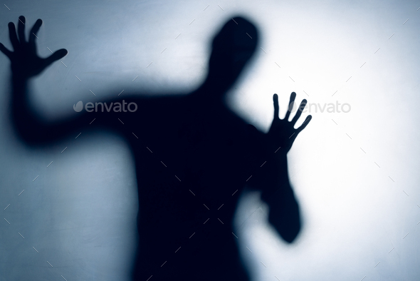 Composition of black silhouette of man with shadows on white background ...