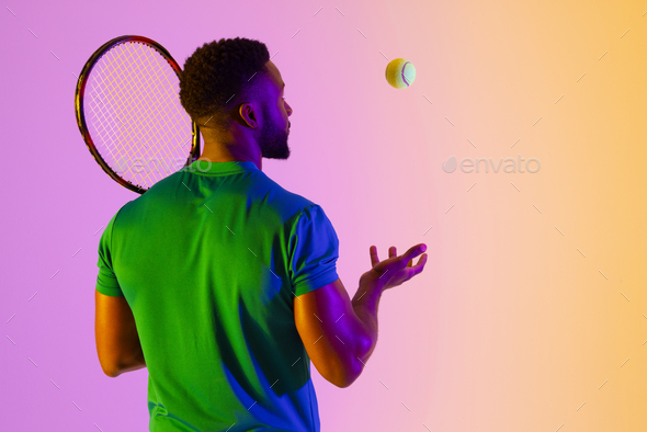 Image of back view of african american male tennis player in violet and ...