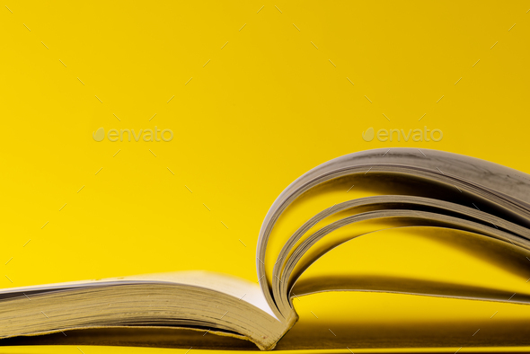Image of open book on yellow surface with copy space Stock Photo by ...