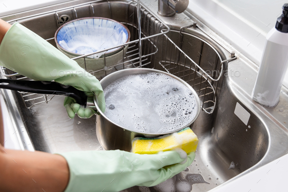 Wash dishes in the kitchen Stock Photo by leungchopan | PhotoDune