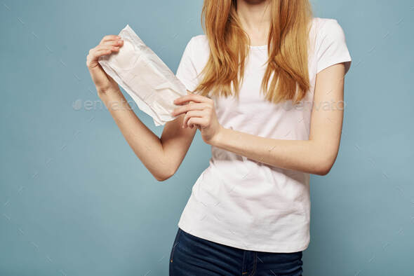 Girl with a pad on a blue background critical days menstruation hygiene ...