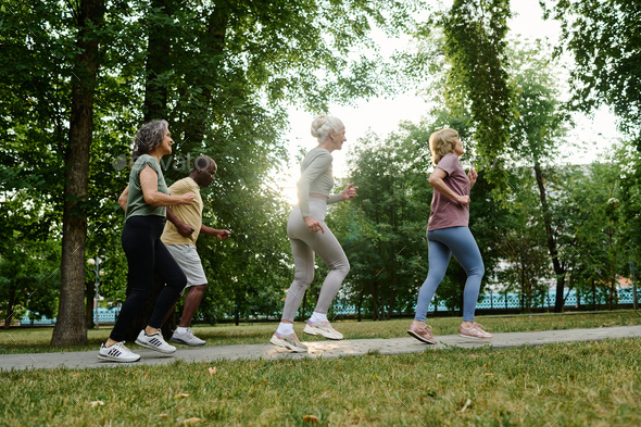 Senior people running together outdoors Stock Photo by AnnaStills ...