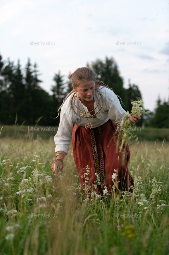Midsummer celebration countryside- woman wearing national costume ...