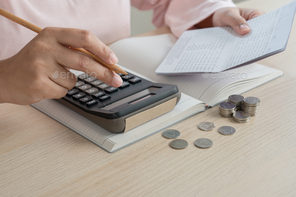 Woman doing home accounting calculating book bank statement for ...