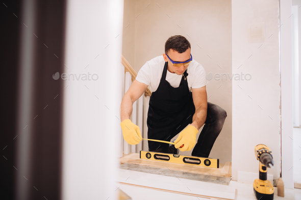 Maintenance man working with a level measurement tool Stock Photo by ...