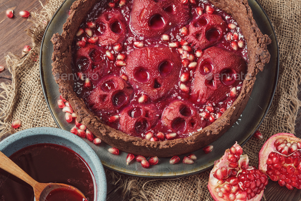 Halloween food. Homemade pie with jam and scary skull-shaped pears ...