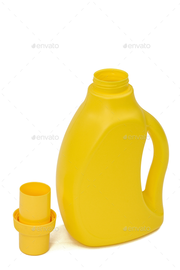 Yellow plastic bottle with a dispenser in cap, isolated on white ...