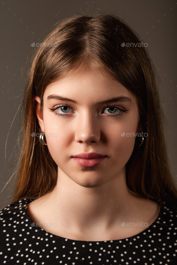 Closeup portrait of pretty jewish teenage girl with long hair and blue ...