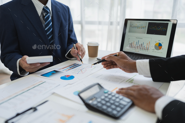 team work process Business team use calculator to calculate figures ...