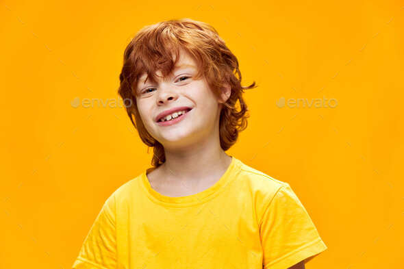Red-haired boy laughing into the camera and expressive appearance Stock ...