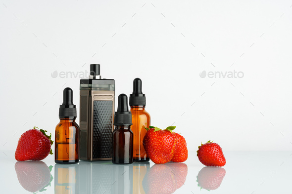 Electronic cigarette liquid with strawberry flavor on white background ...