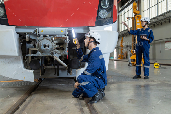 Engineer checks spare parts list and maintains mass transit locomotives ...