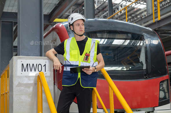 Engineer checks spare parts list and maintains mass transit locomotives ...