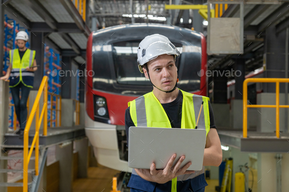 Engineer checks spare parts list and maintains mass transit locomotives ...