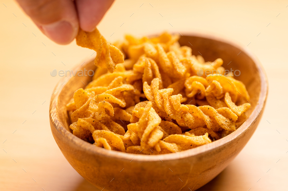 Traditional snack crispy bean twist cracker Stock Photo by leungchopan