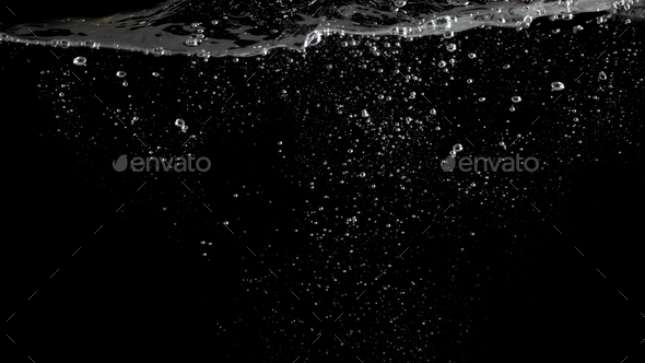 Bubbles underwater splashing and floating up and black color background ...