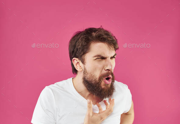 Angry man yells on pink background stress irritability model Stock ...