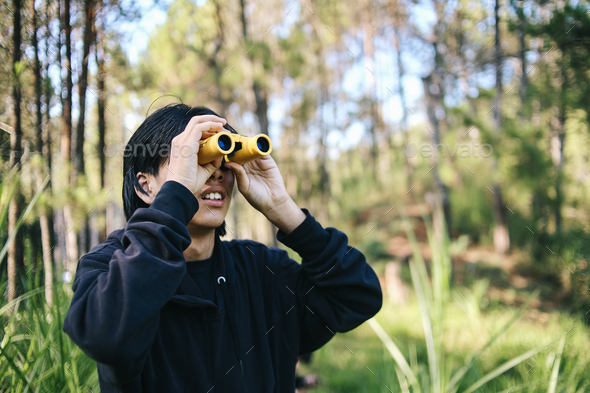 Explorer using Binocular Stock Photo by Queenmoonlite35 | PhotoDune