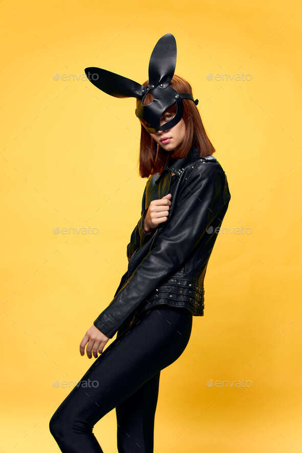 Sexy woman in rabbit mask and black suit, temptation Stock Photo by ...
