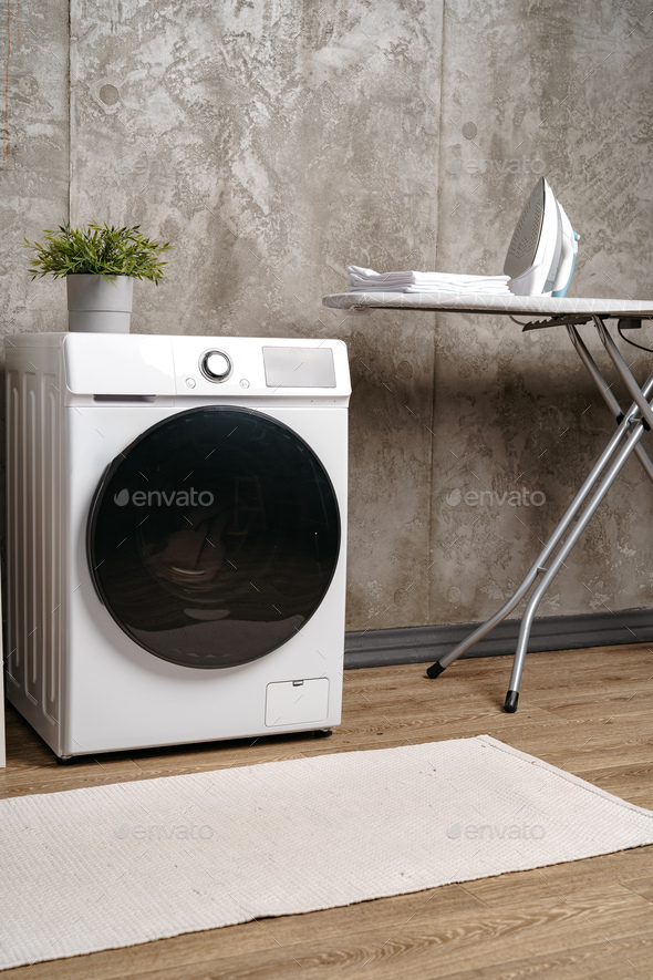 Cropped photos of bathroom interior with washing machine Stock Photo by ...