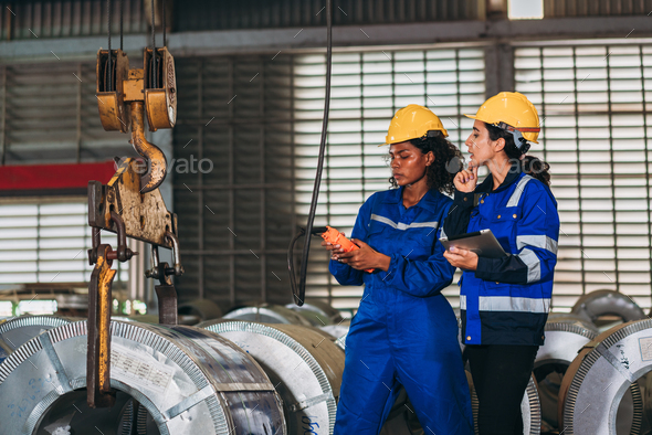 Engineers Inspecting Machinery at Metal Sheet Factory. Foreman ...