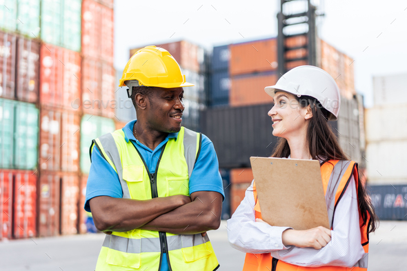 Caucasian businesswoman engineer working in container terminal port ...