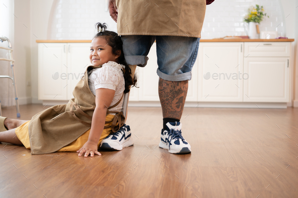 A plus size family with a father wearing a prosthetic leg, The daughter ...