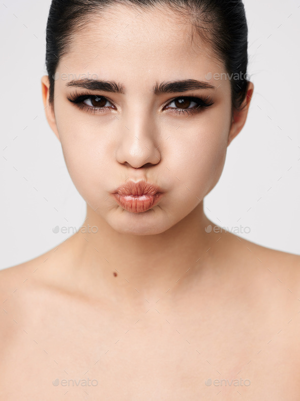 pretty brunette makeup facial bare shoulders puffy cheeks Stock Photo ...