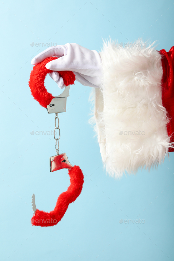 Handcuffs for adults with Santa on their hands. Stock Photo by ...