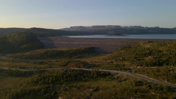 aerial footage near Sysenvatnet lake at autumn, Norway. Sysen dam as ...