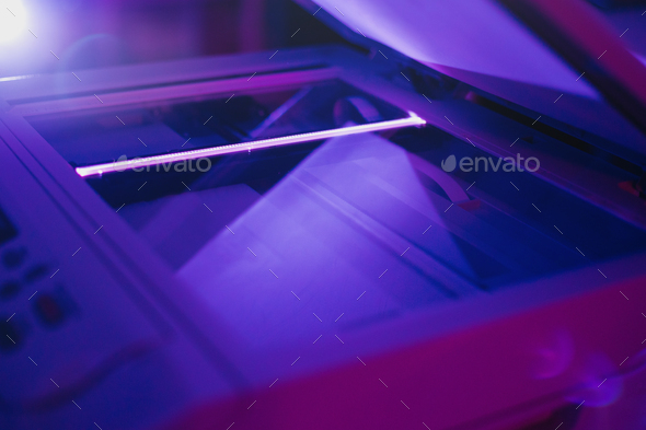 Copier scanner with a bright light inside. Office hazards Stock Photo ...