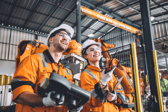 engineer team working together training new staff worker to operate ...