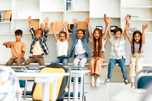 Children learning in a school classroom Stock Photo by ORION_production