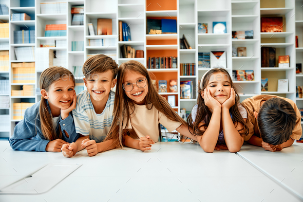 Children learning in a school classroom Stock Photo by ORION_production