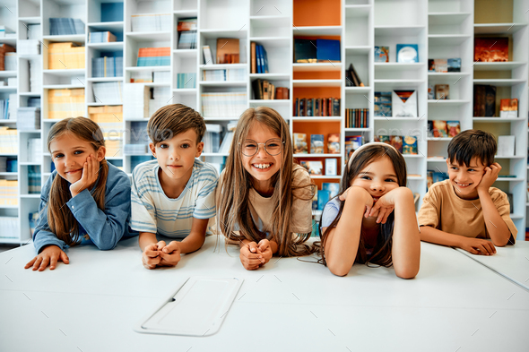 Children learning in a school classroom Stock Photo by ORION_production